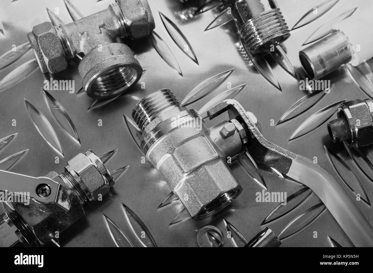 Plumbing Kit on a metal surface Stock Photo - Alamy