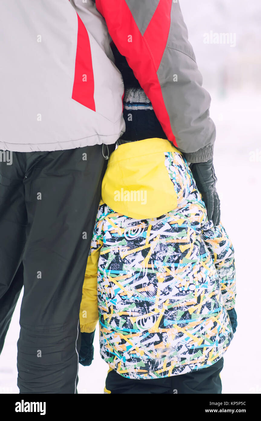 Father holds the boy's hand in winter clothes, winter, family, hand in ...