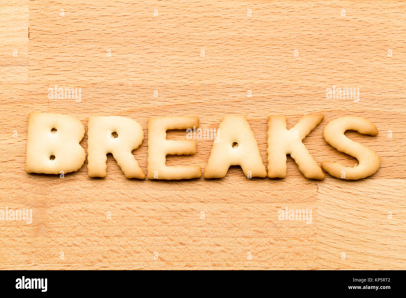 Word break biscuit over the wooden background Stock Photo - Alamy