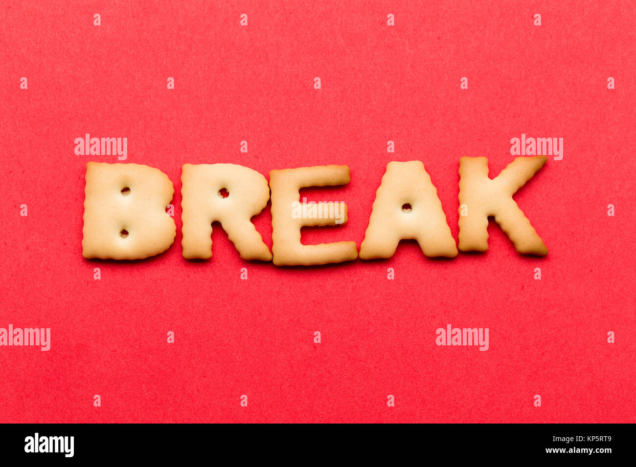 Word break cookie over the red background Stock Photo - Alamy