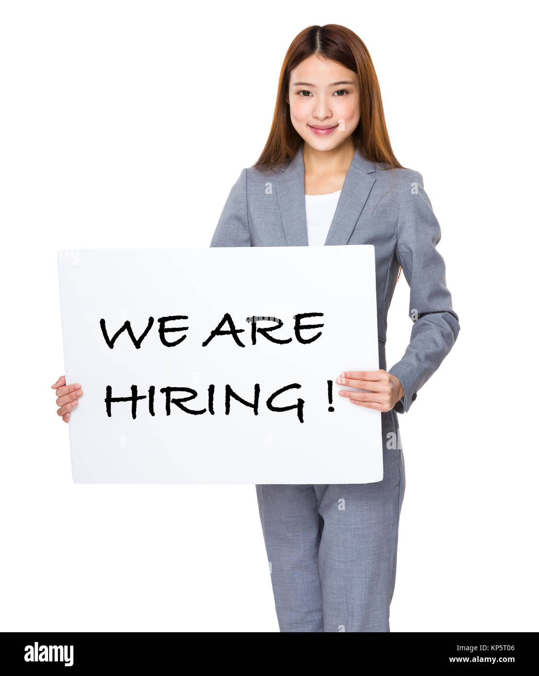 Business woman show with white banner for phrase of we are hiring Stock ...