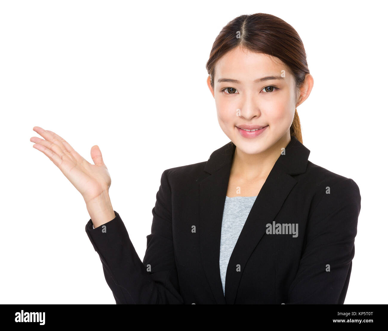 Young businesswoman with hand showing something Stock Photo - Alamy