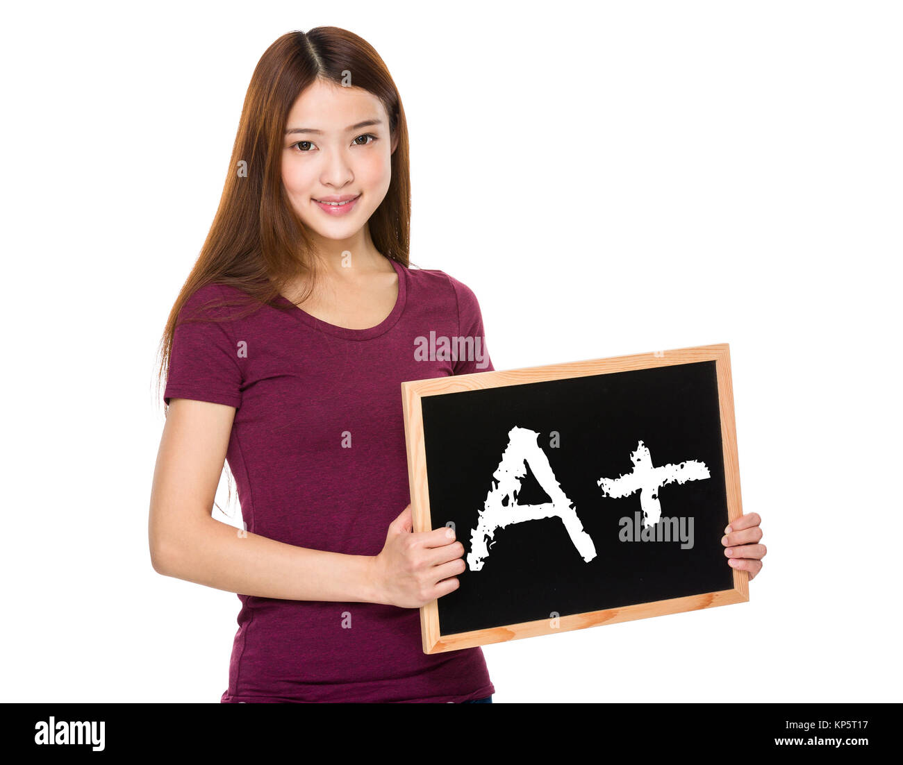 Young student hold with chalkboard showing A plus mark Stock Photo - Alamy