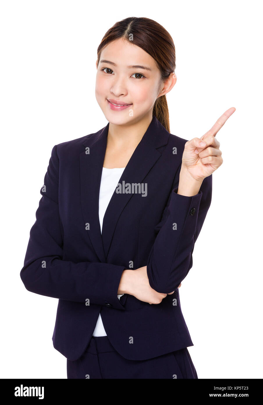 Businesswoman with finger pointing upwards Stock Photo - Alamy