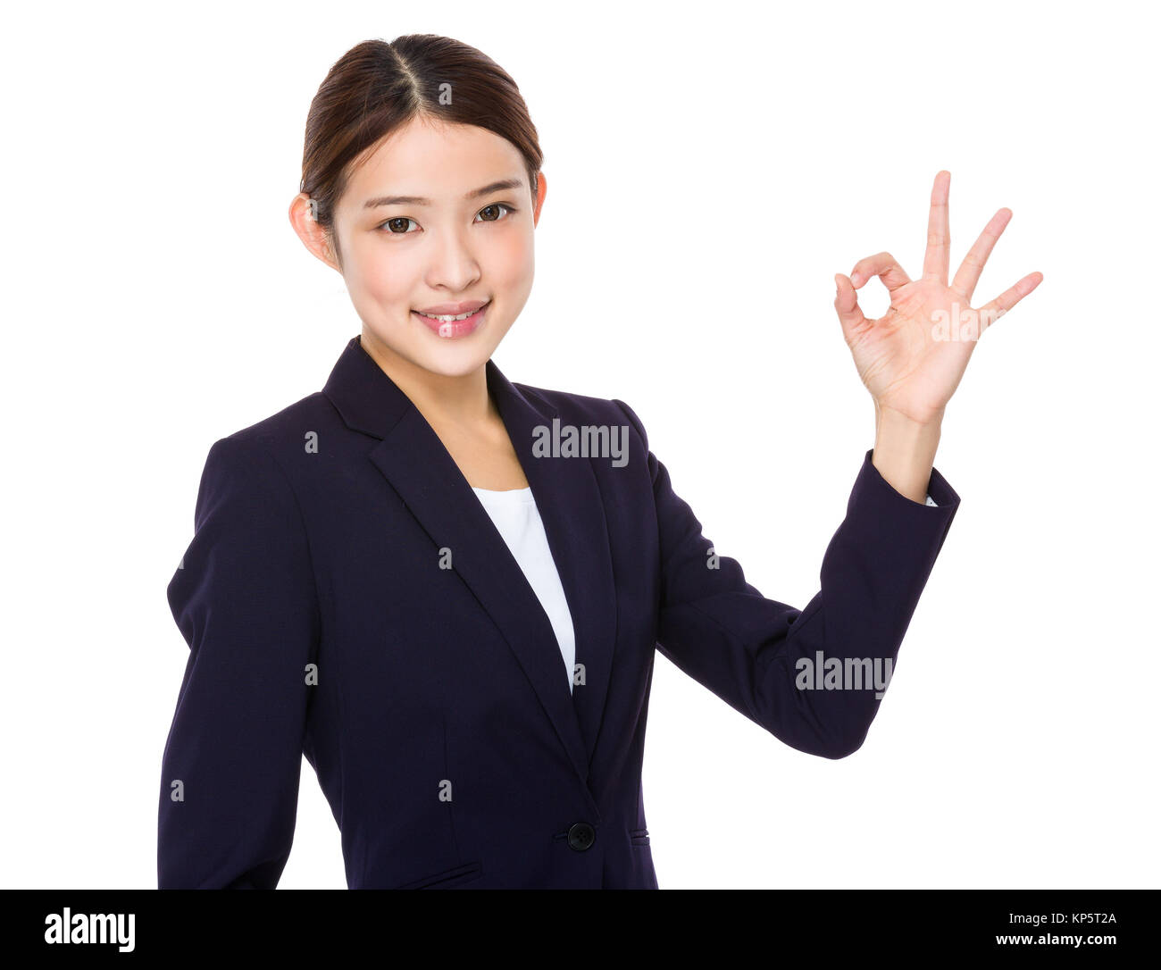 Young businesswoman with ok sign gesture Stock Photo - Alamy