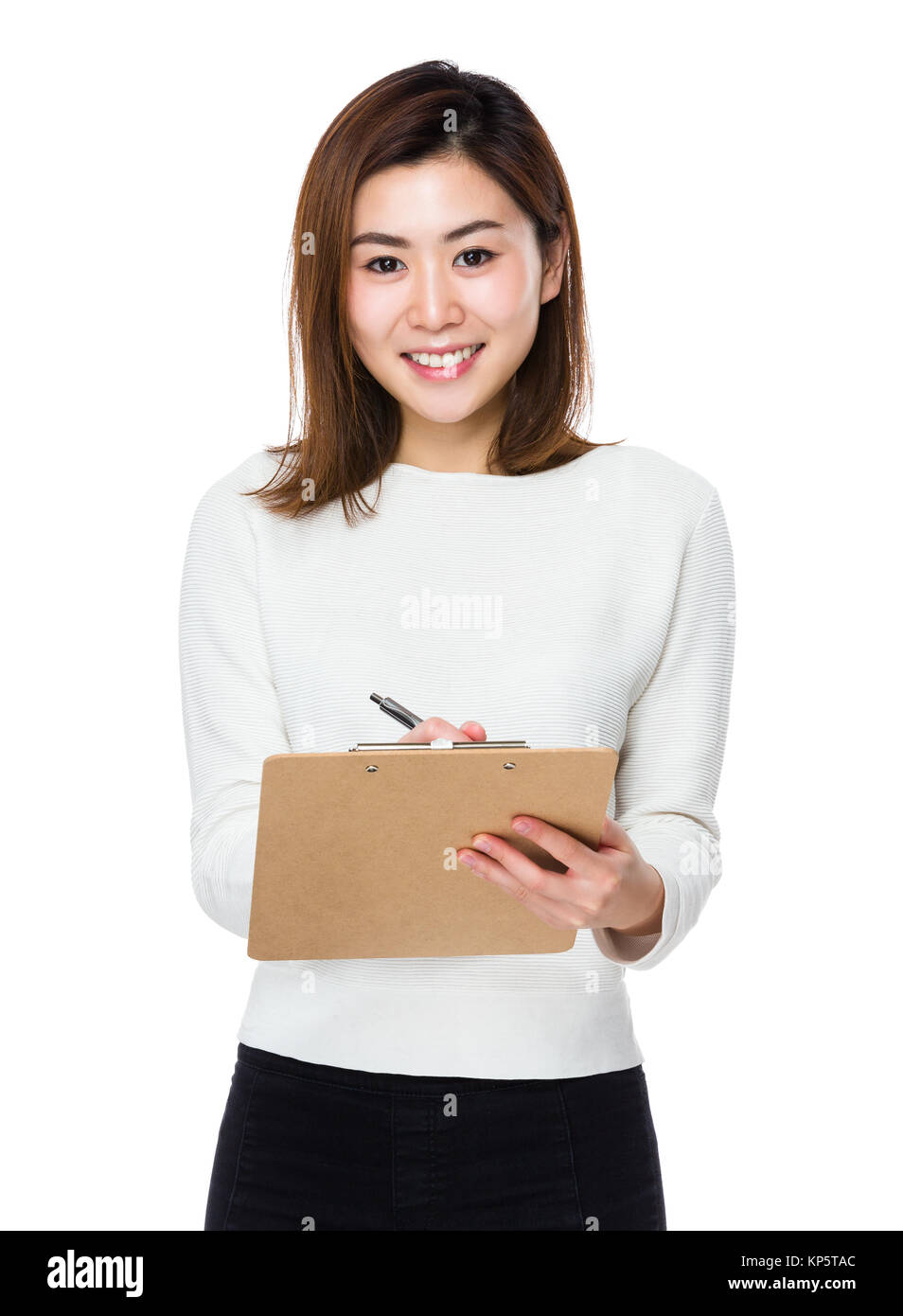 Young Woman take note on clipboard Stock Photo - Alamy