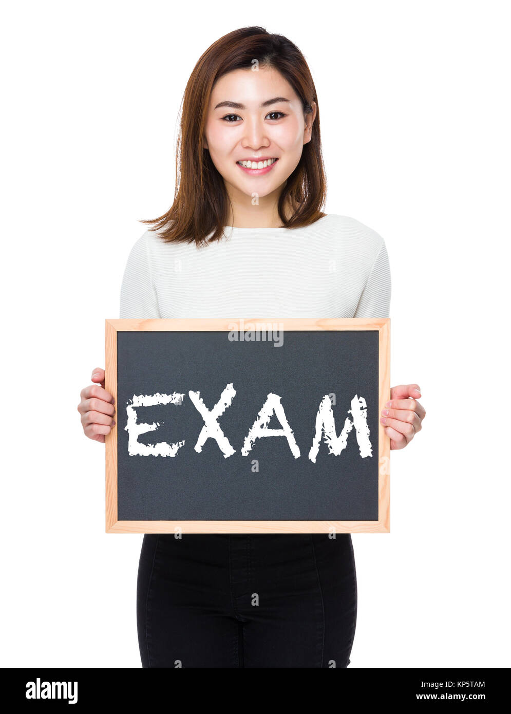 Young woman with the blackboard showing a word exam Stock Photo - Alamy