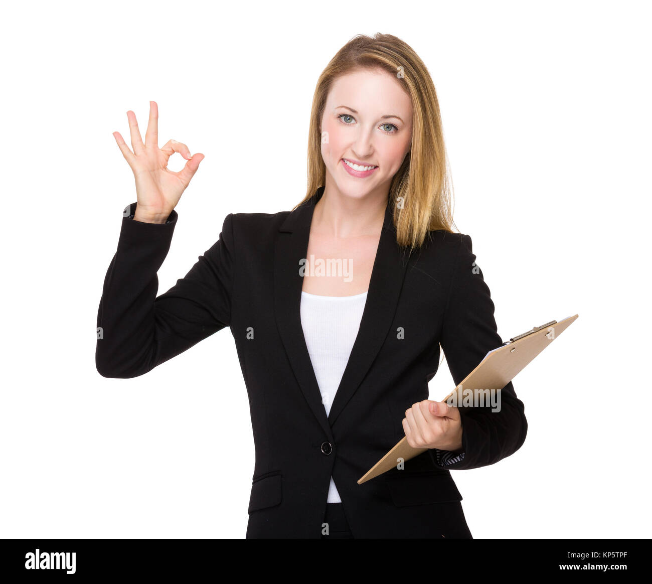 Businesswoman with clipboard and ok sign gesture Stock Photo - Alamy