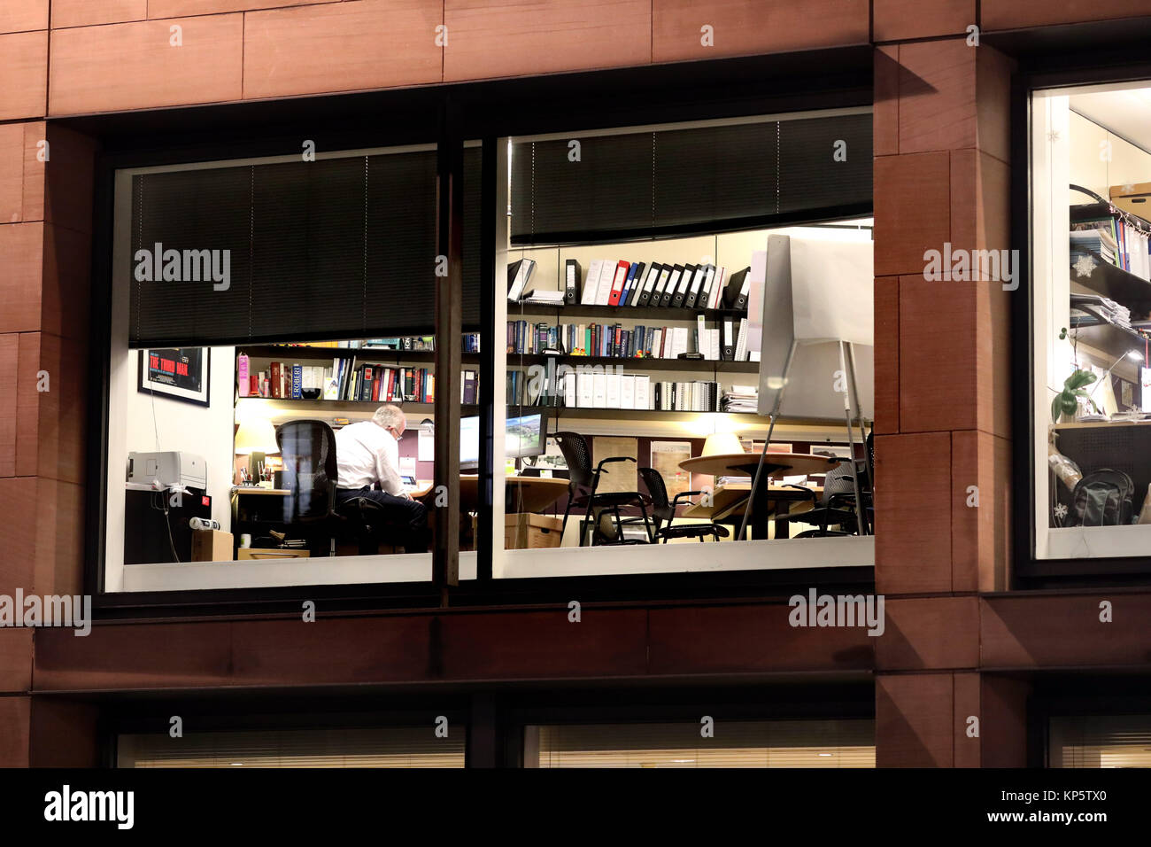 man working late in office Stock Photo - Alamy