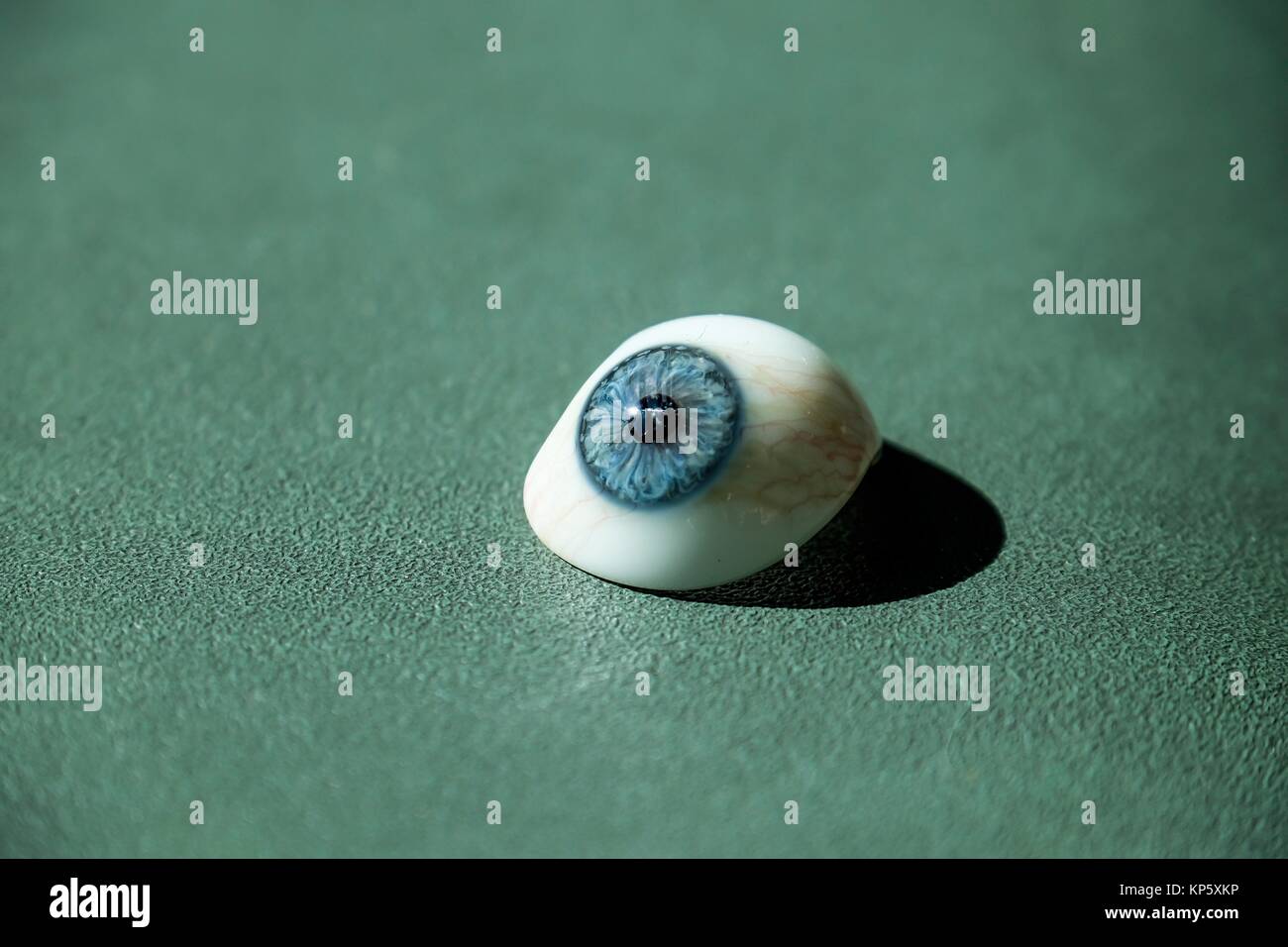 Human Glass-Eye on a blue green underground Stock Photo - Alamy