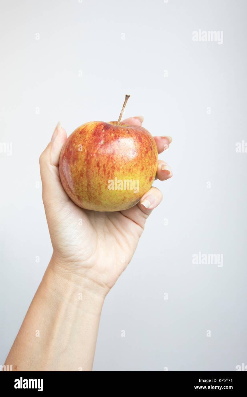 Hand squeezing apple hi-res stock photography and images - Alamy