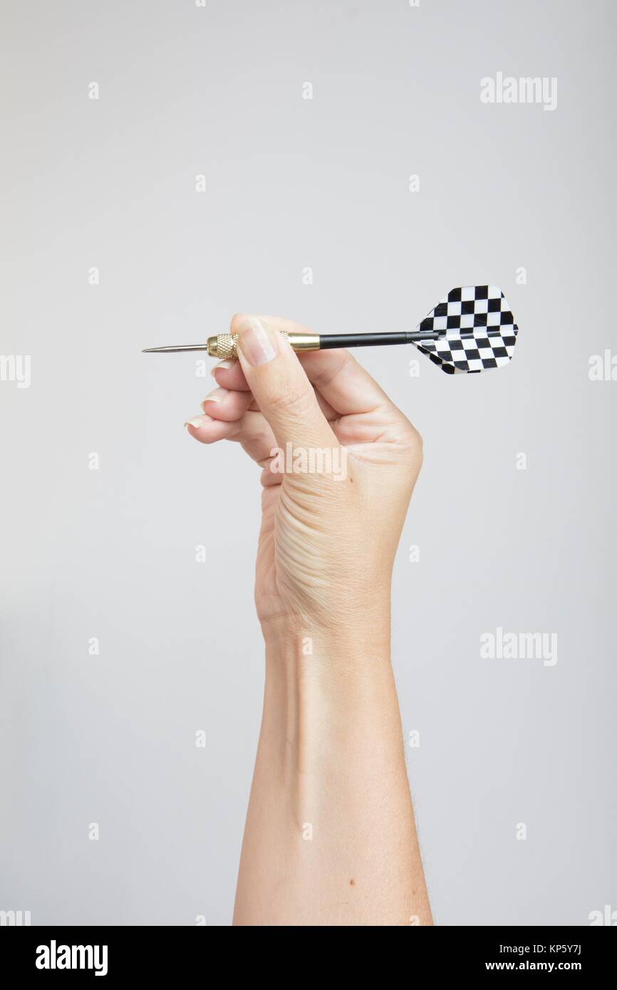 Female hand holding dart hi-res stock photography and images - Alamy