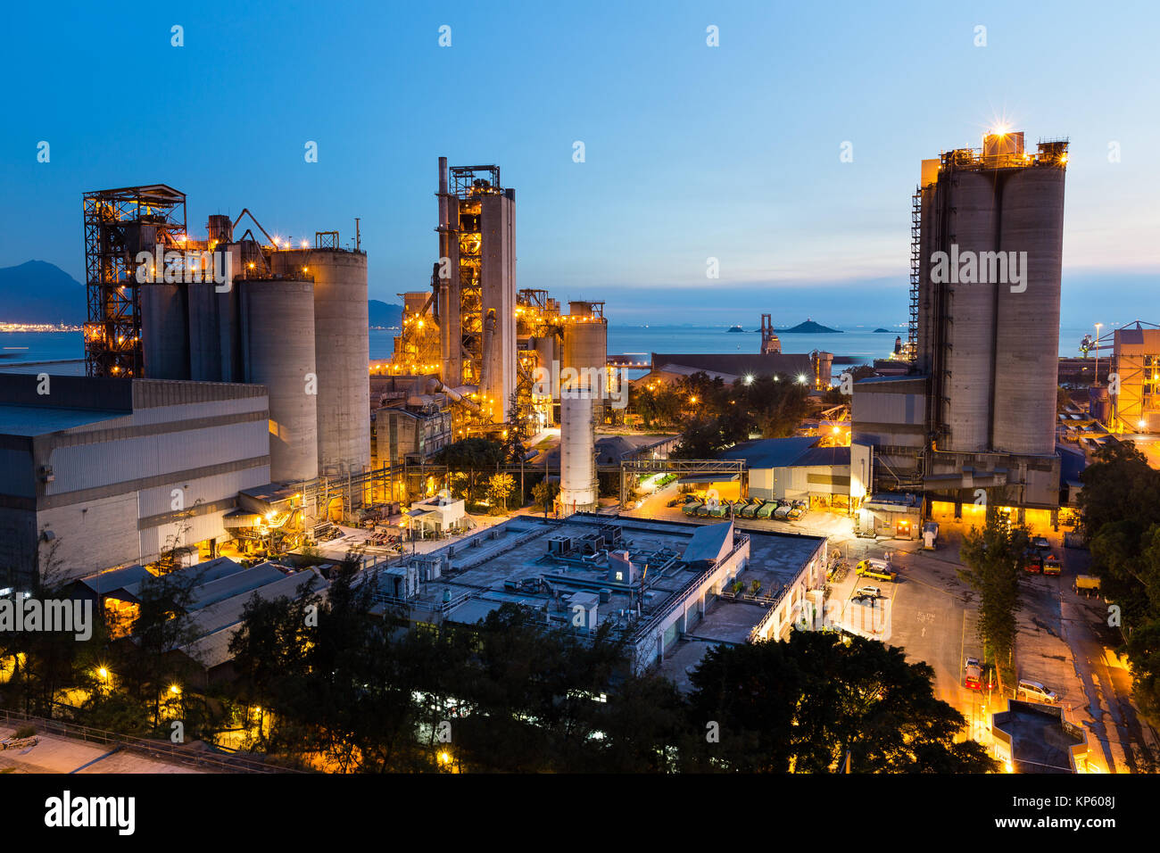 Cement factory at night Stock Photo - Alamy