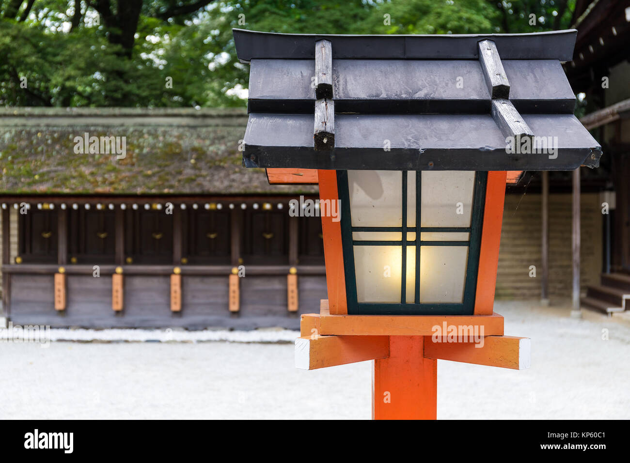 Traditional red lamp pole in Japanese temple Stock Photo - Alamy