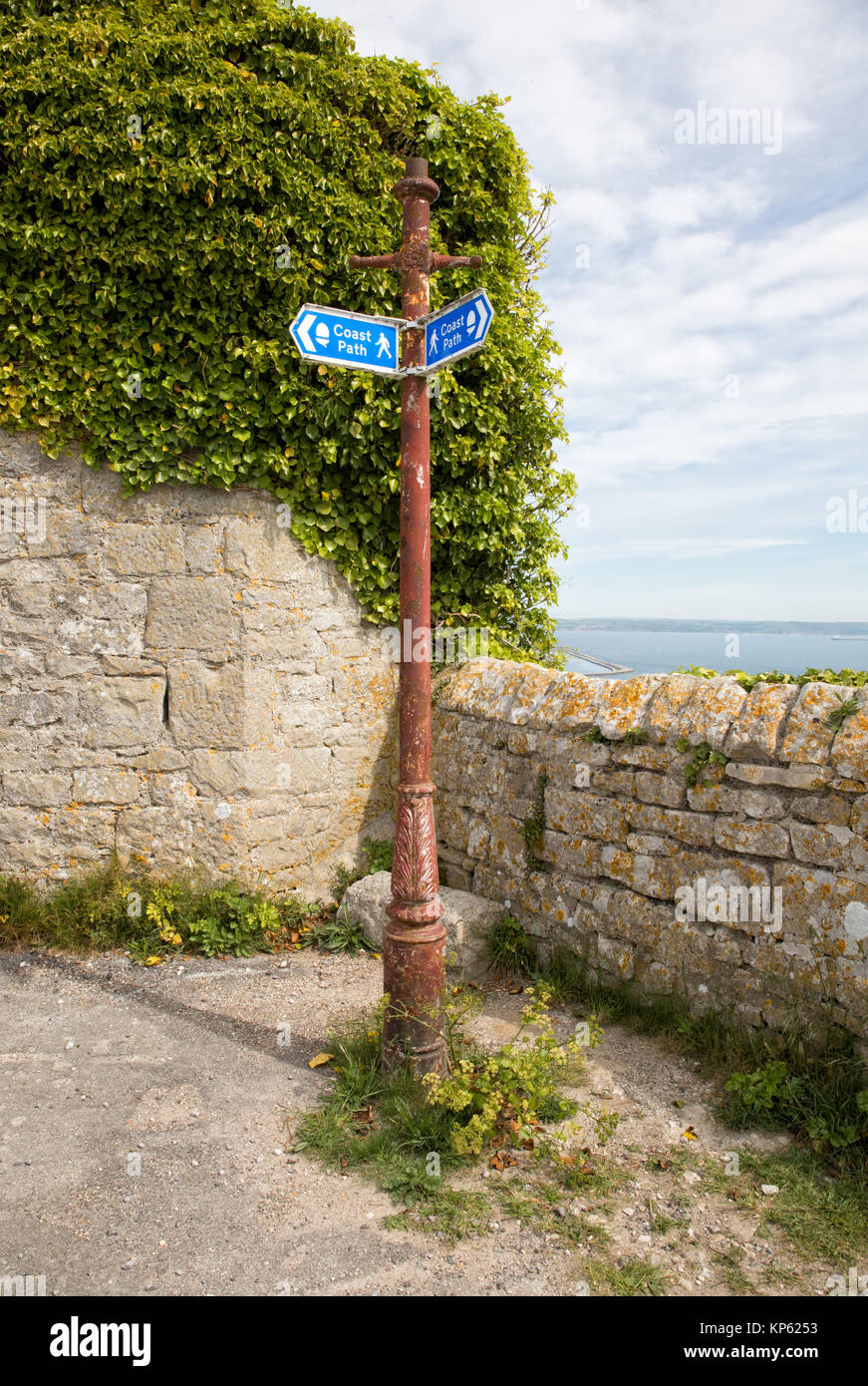 South West Coast Path waymarker attached to an old lamp post on ...
