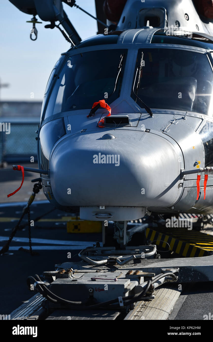 Helicopter parked on a platform of a war frigate Stock Photo - Alamy