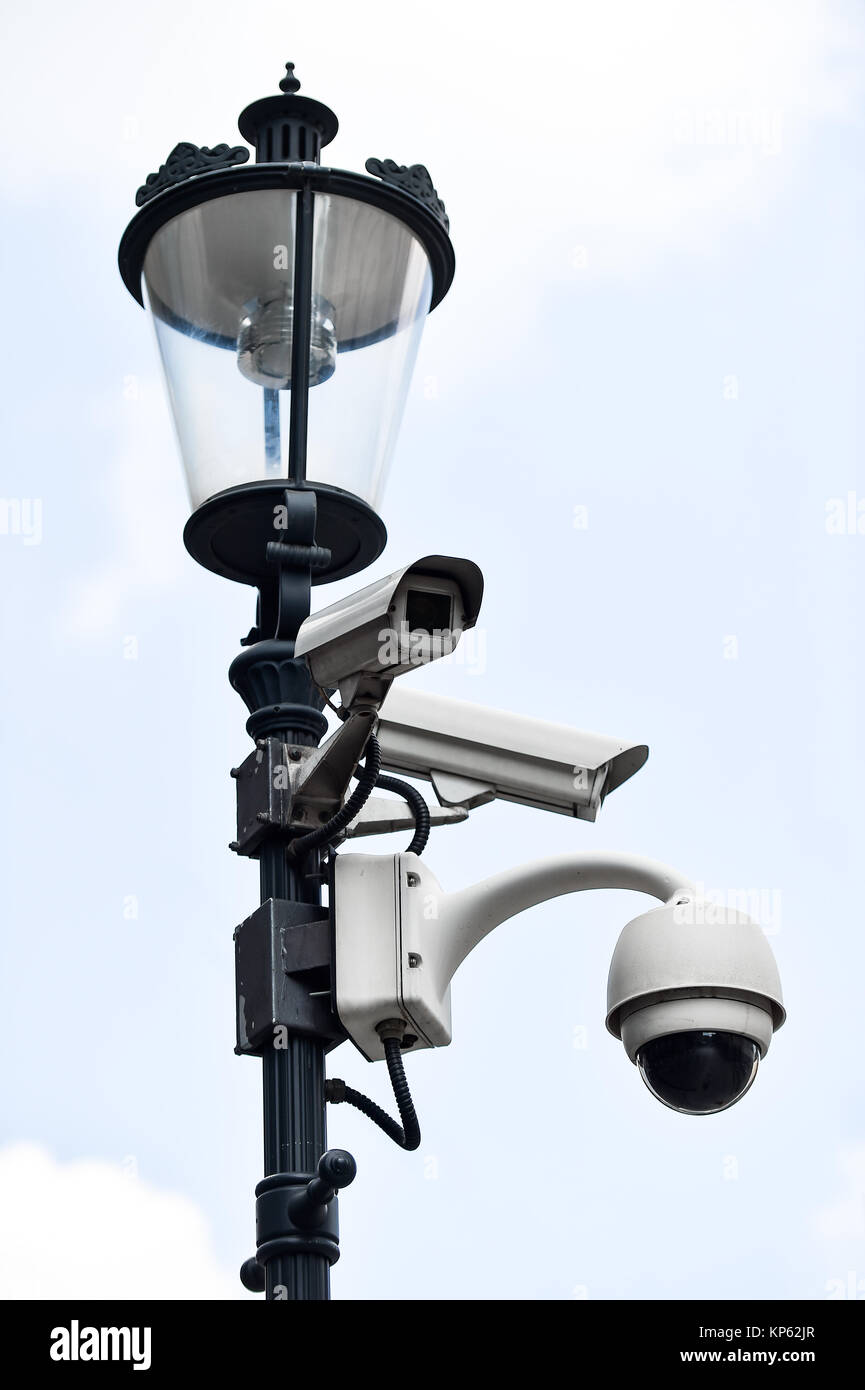 Video surveillance camera on a lighting pole Stock Photo - Alamy