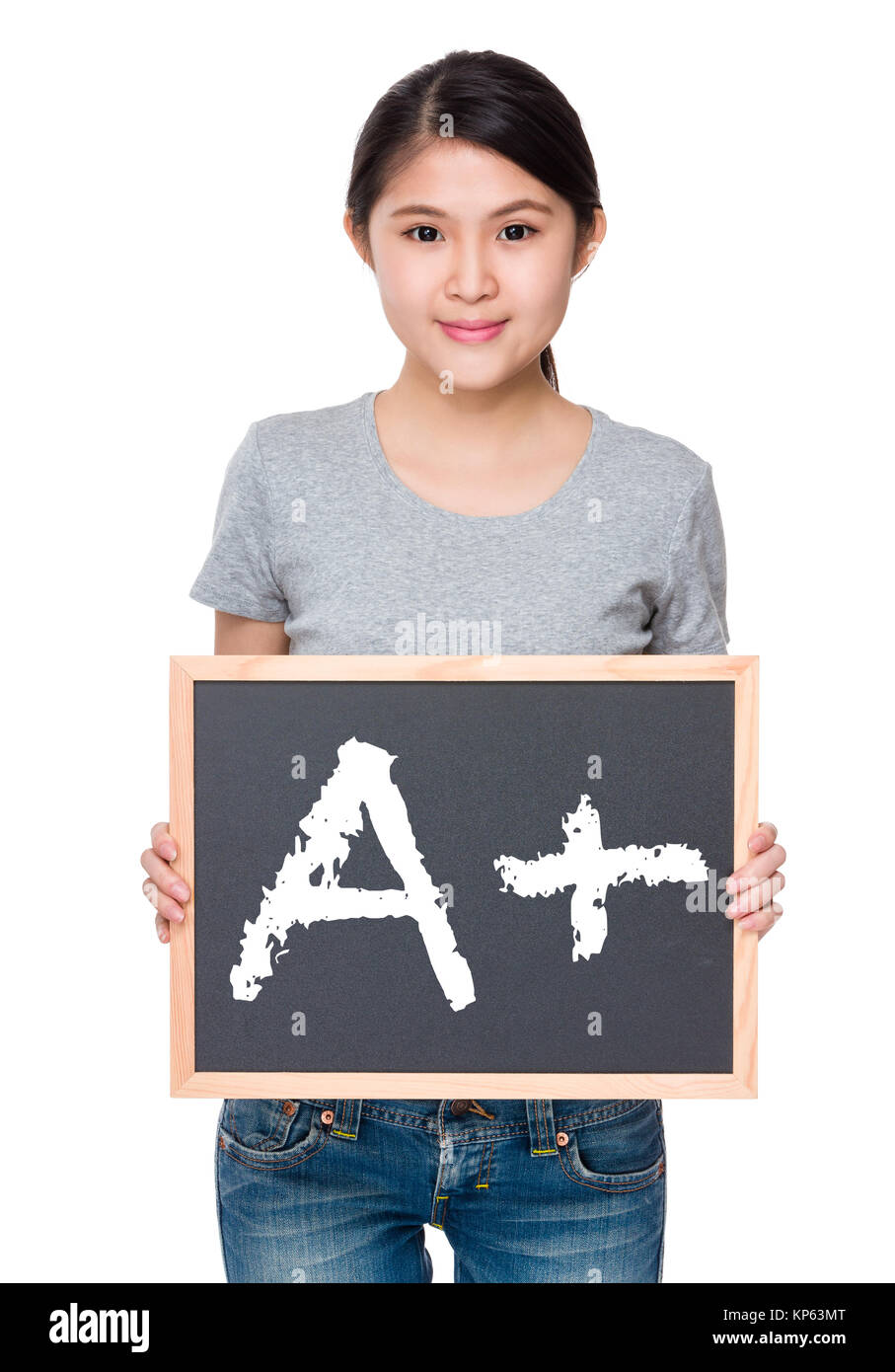 Woman hold with chalkboard and showing A plus mark Stock Photo - Alamy