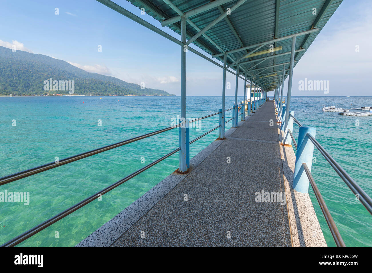 Jetty with green water Stock Photo - Alamy
