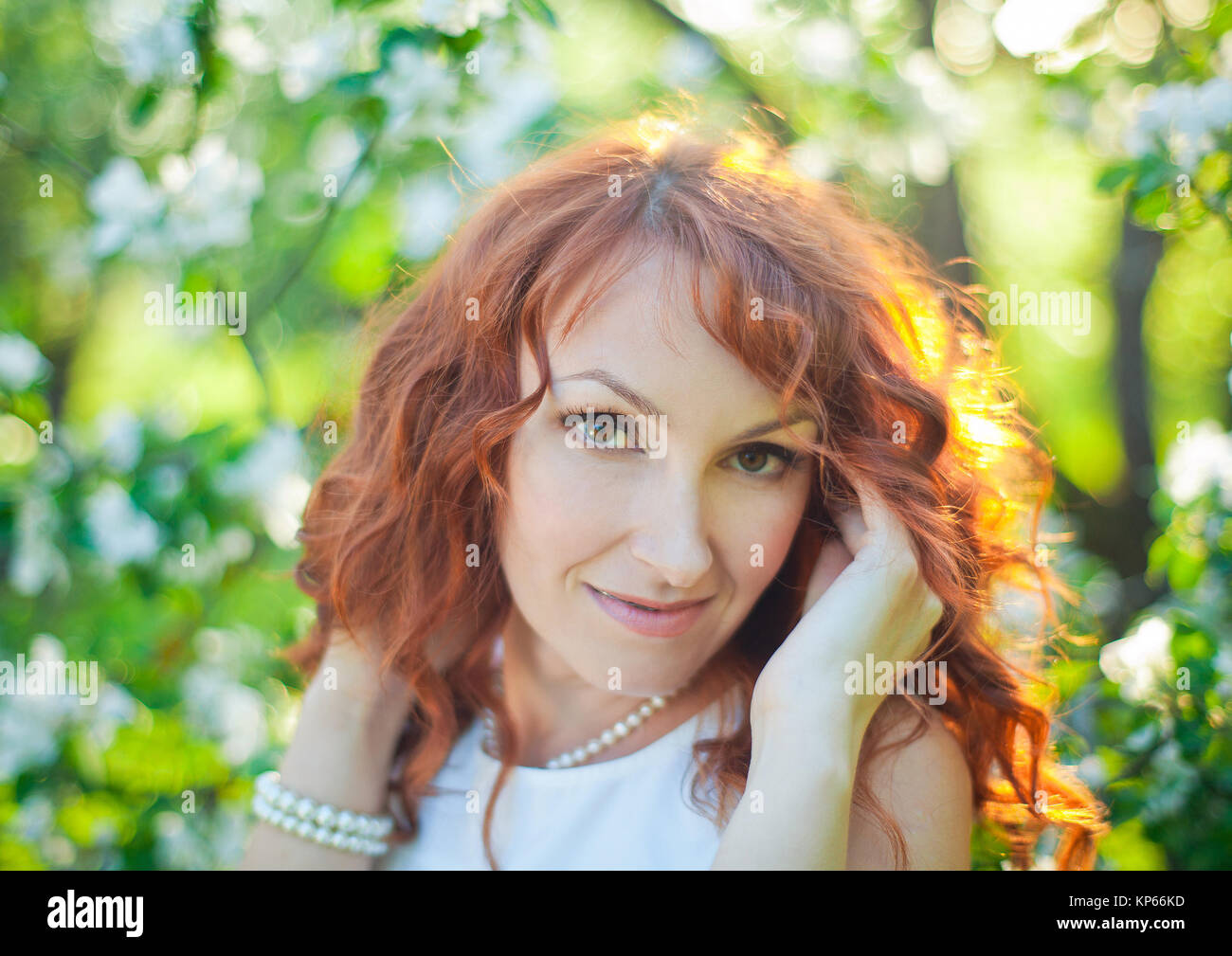 Spring fashion girl outdoor portrait in blooming trees. Beauty Romantic ...