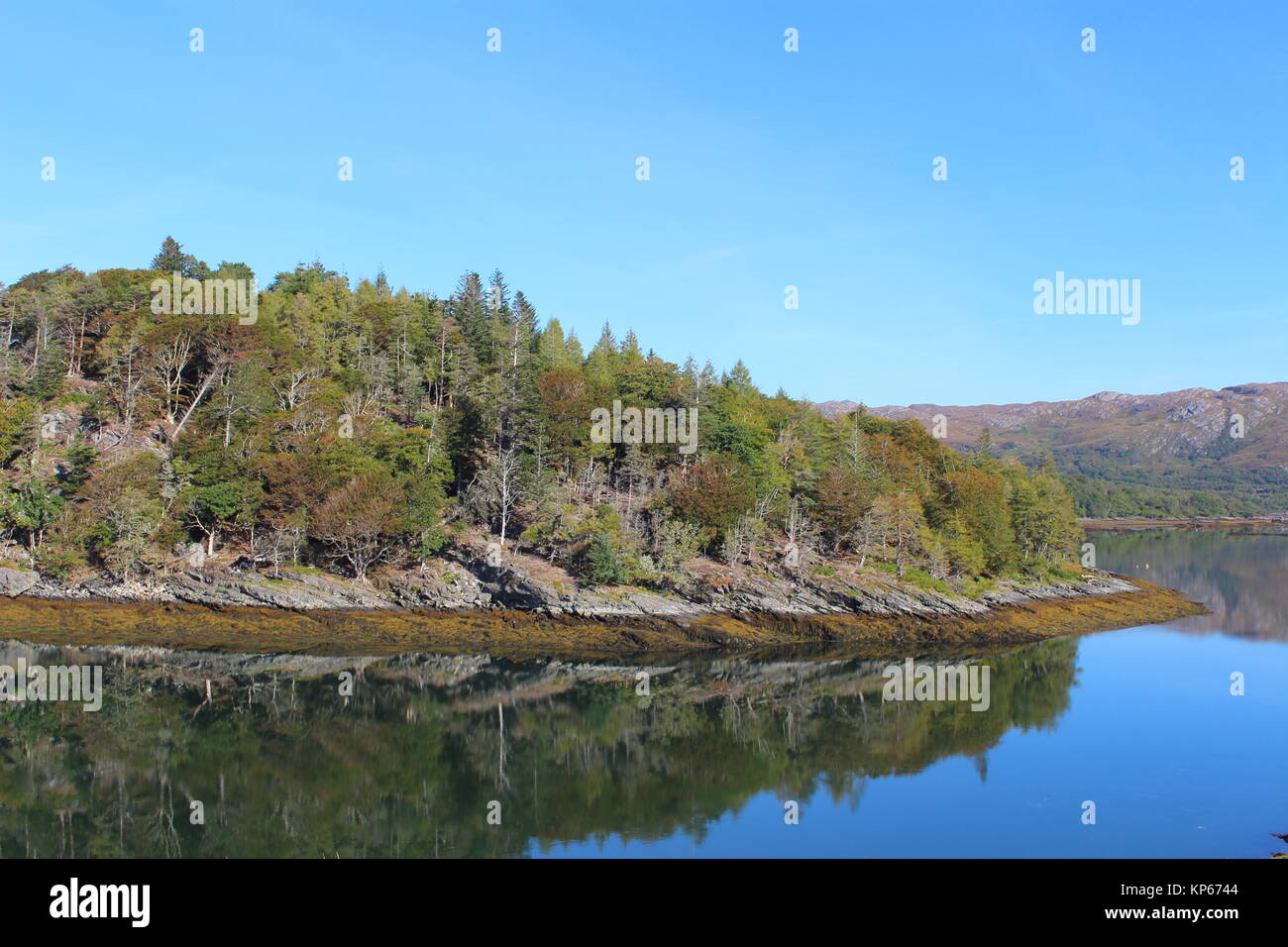spiegleung in a scottish lake Stock Photo - Alamy