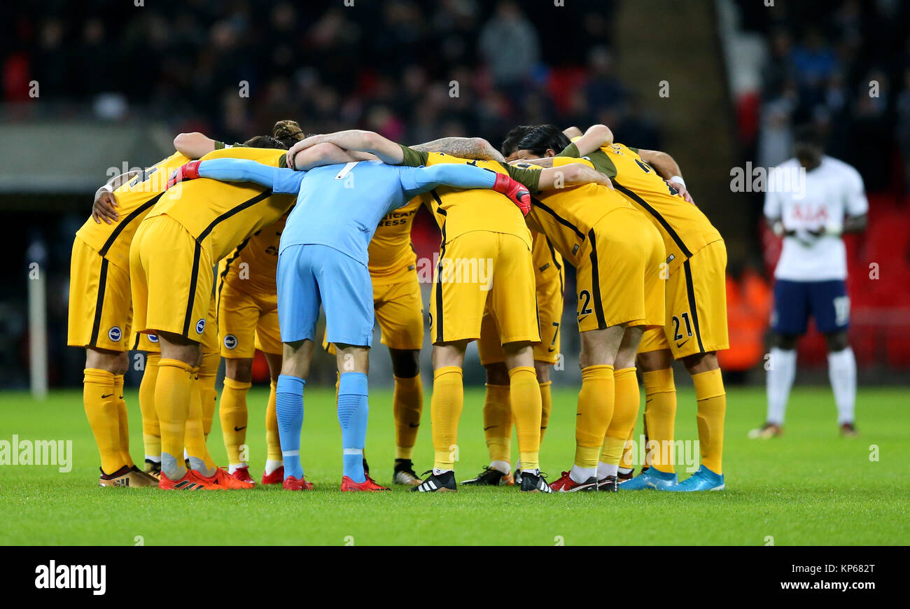 Brighton & Hove Albion players huddle prior to kick off during the ...