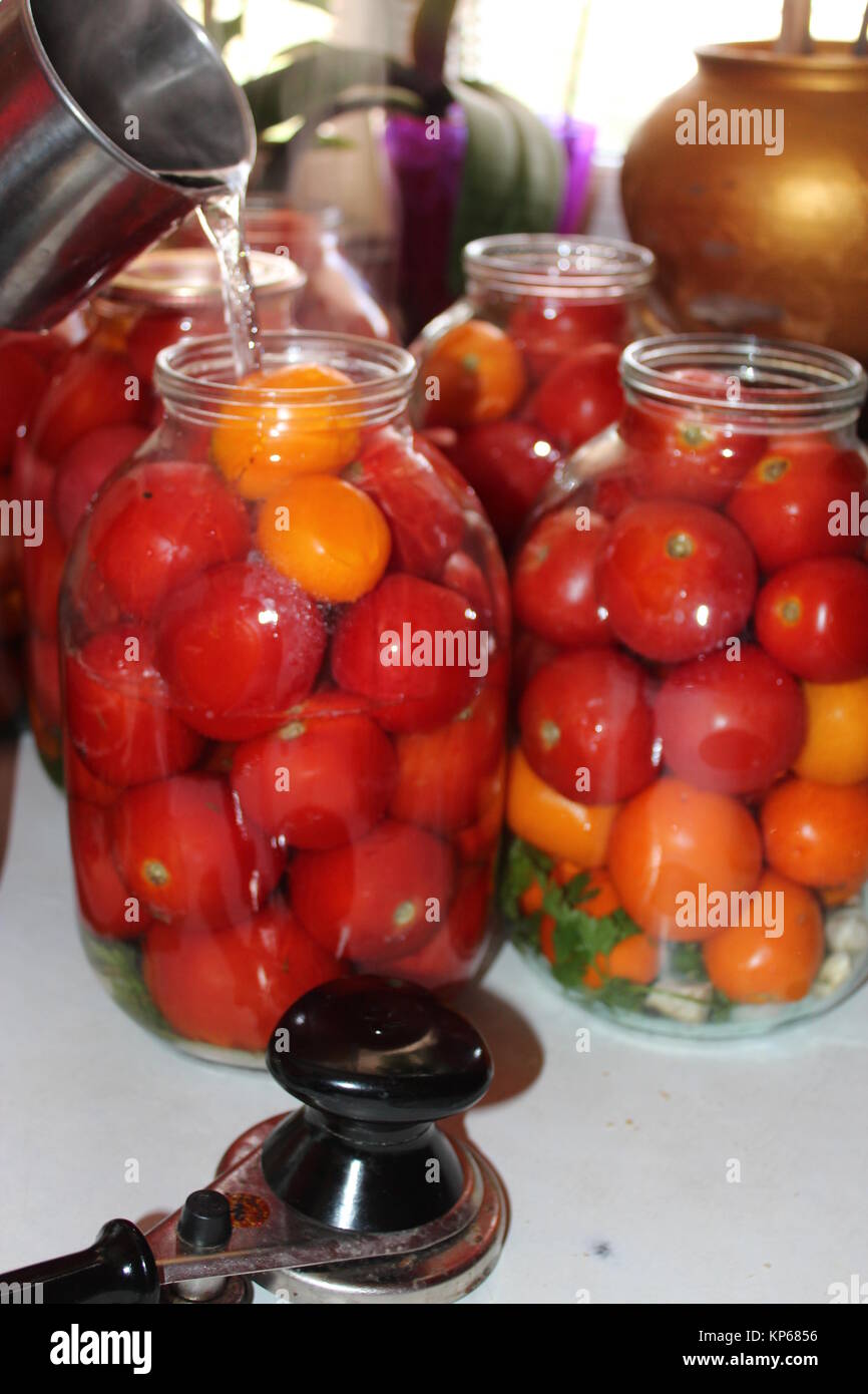 tomatoes in the jars prepared for preservation Stock Photo - Alamy