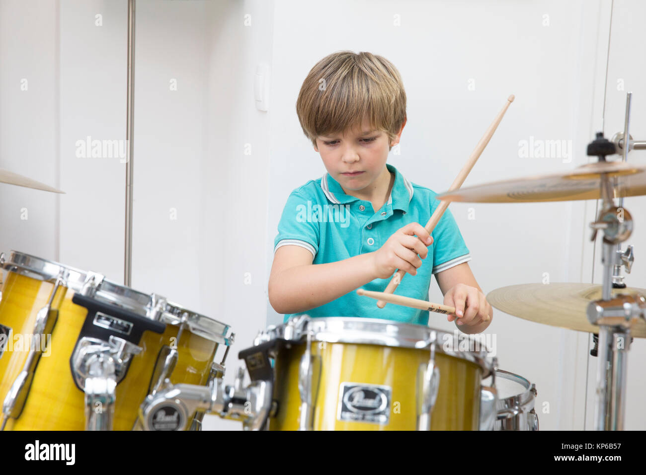 Boys playing musical instruments hi-res stock photography and images ...