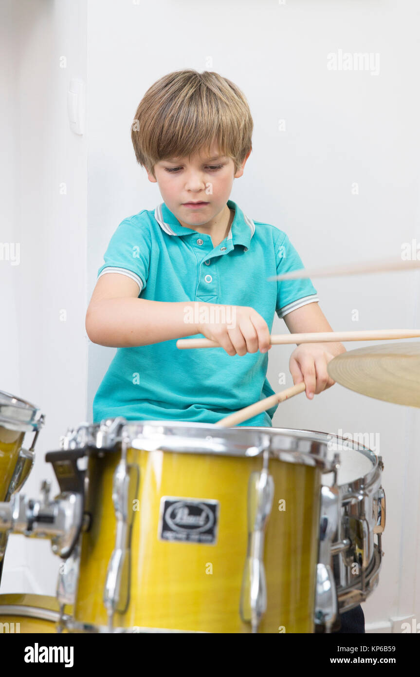 Boys playing musical instruments hi-res stock photography and images ...