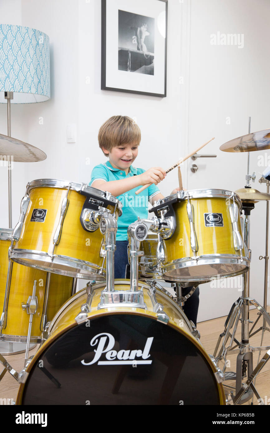 Boys playing musical instruments hi-res stock photography and images ...
