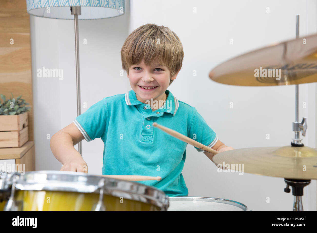 Boys playing musical instruments hi-res stock photography and images ...