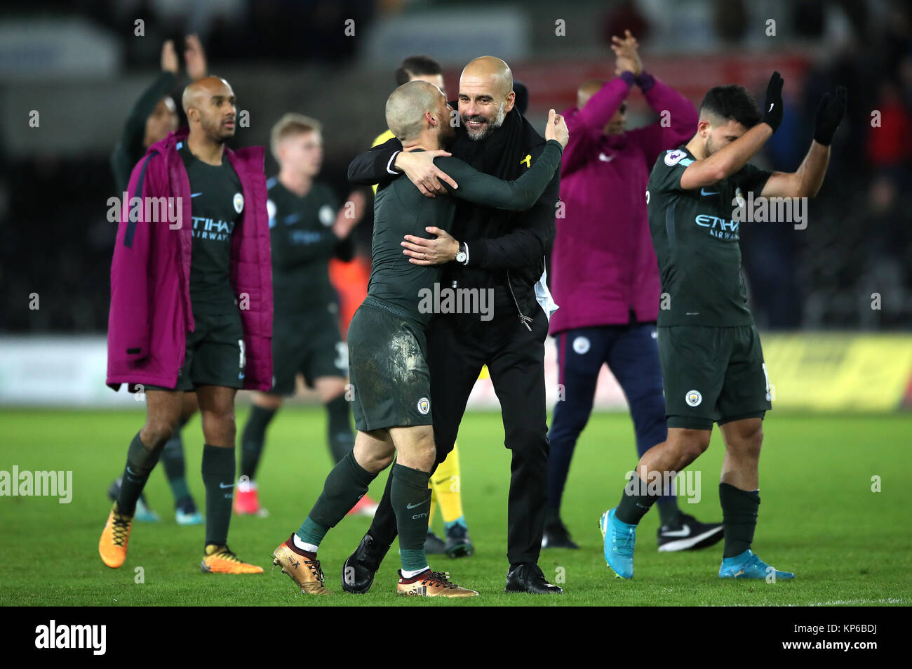 Manchester City manager Pep Guardiola (right) and David Silva (left ...