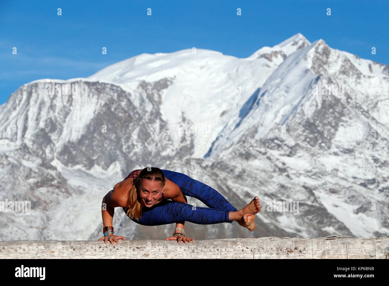 French Alps. Mont-Blanc massif. Woman doing yoga meditation on mountain ...