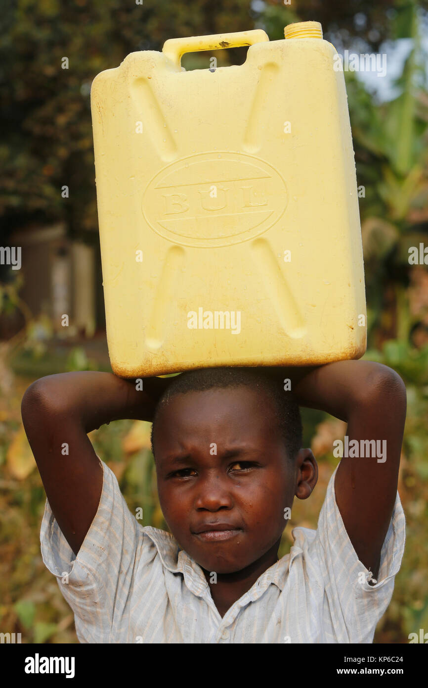 African children fetching water hi-res stock photography and images - Alamy