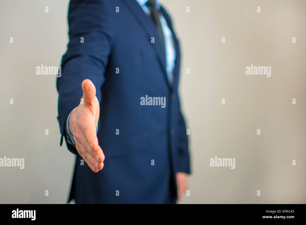 Cropped image of businessman extending hand to shake Stock Photo - Alamy