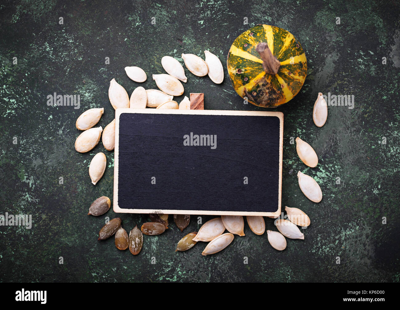 Raw and roasted pumpkin seeds. Top view Stock Photo - Alamy