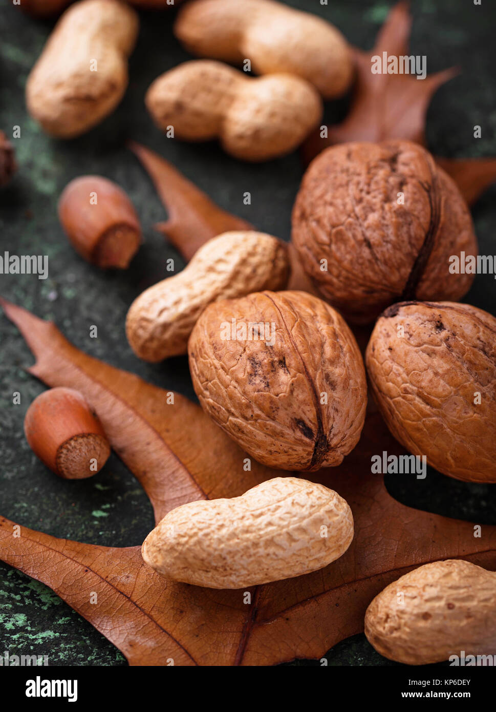 Mix of different nuts. Walnuts, peanuts and hazelnuts. Selective focus ...