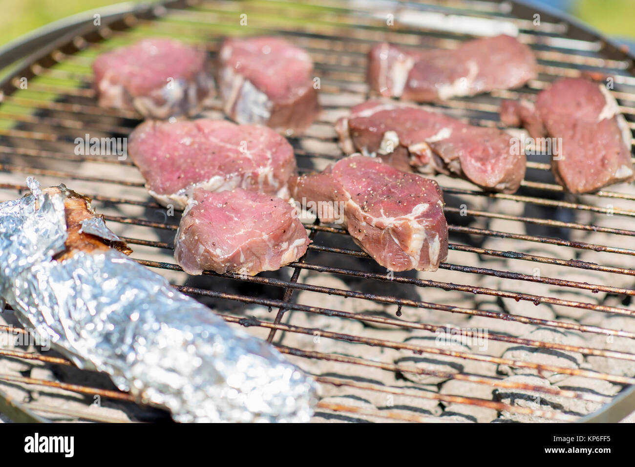 Rindersteak am Grill - beef steak on barbecue Stock Photo - Alamy