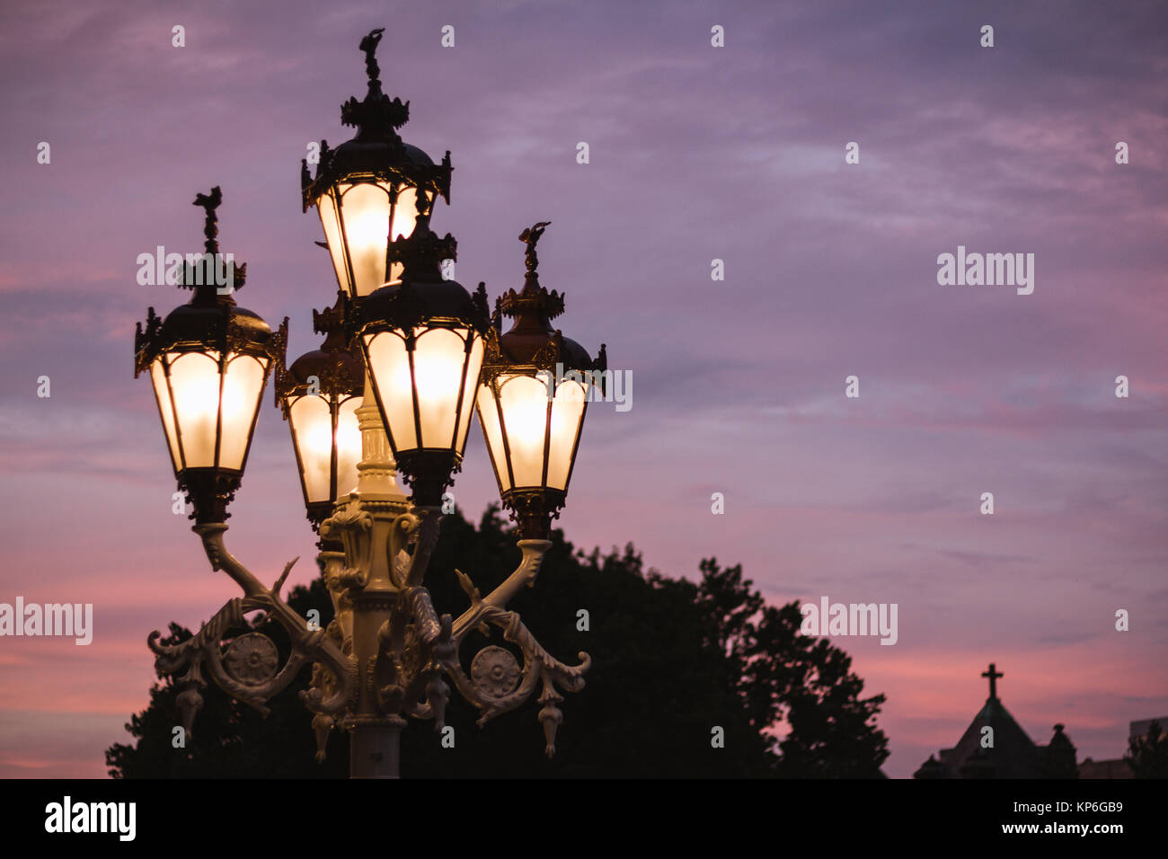 Michigan State Capitol classic city lights shine over a sunset in ...