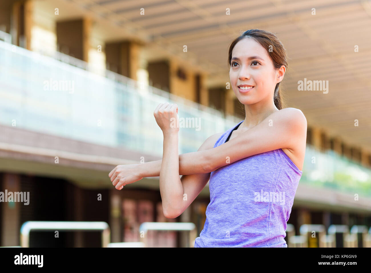 Woman stretching hand at sport stadium Stock Photo - Alamy