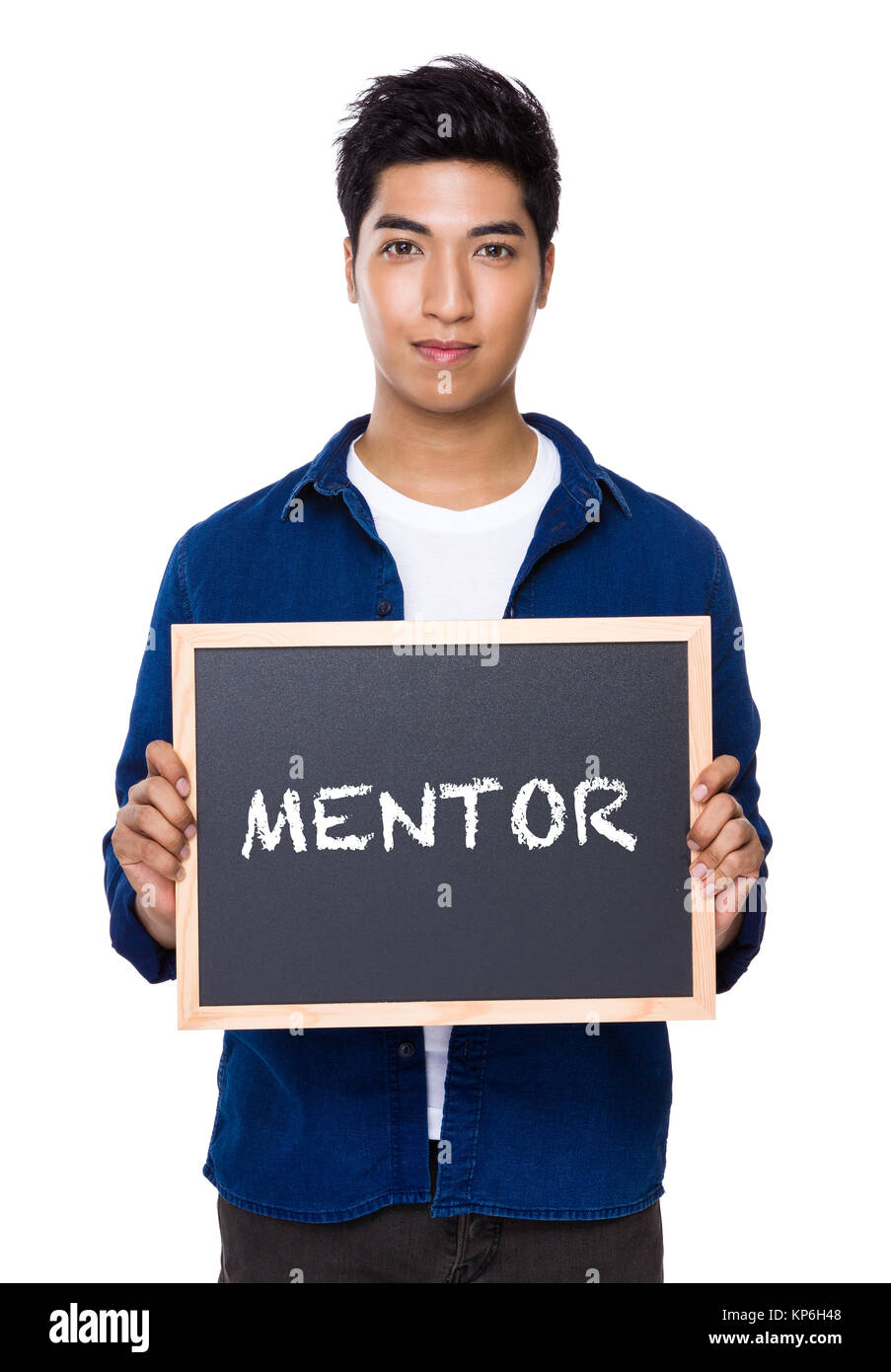 Indian man with chalkboard showing a word mentor Stock Photo - Alamy