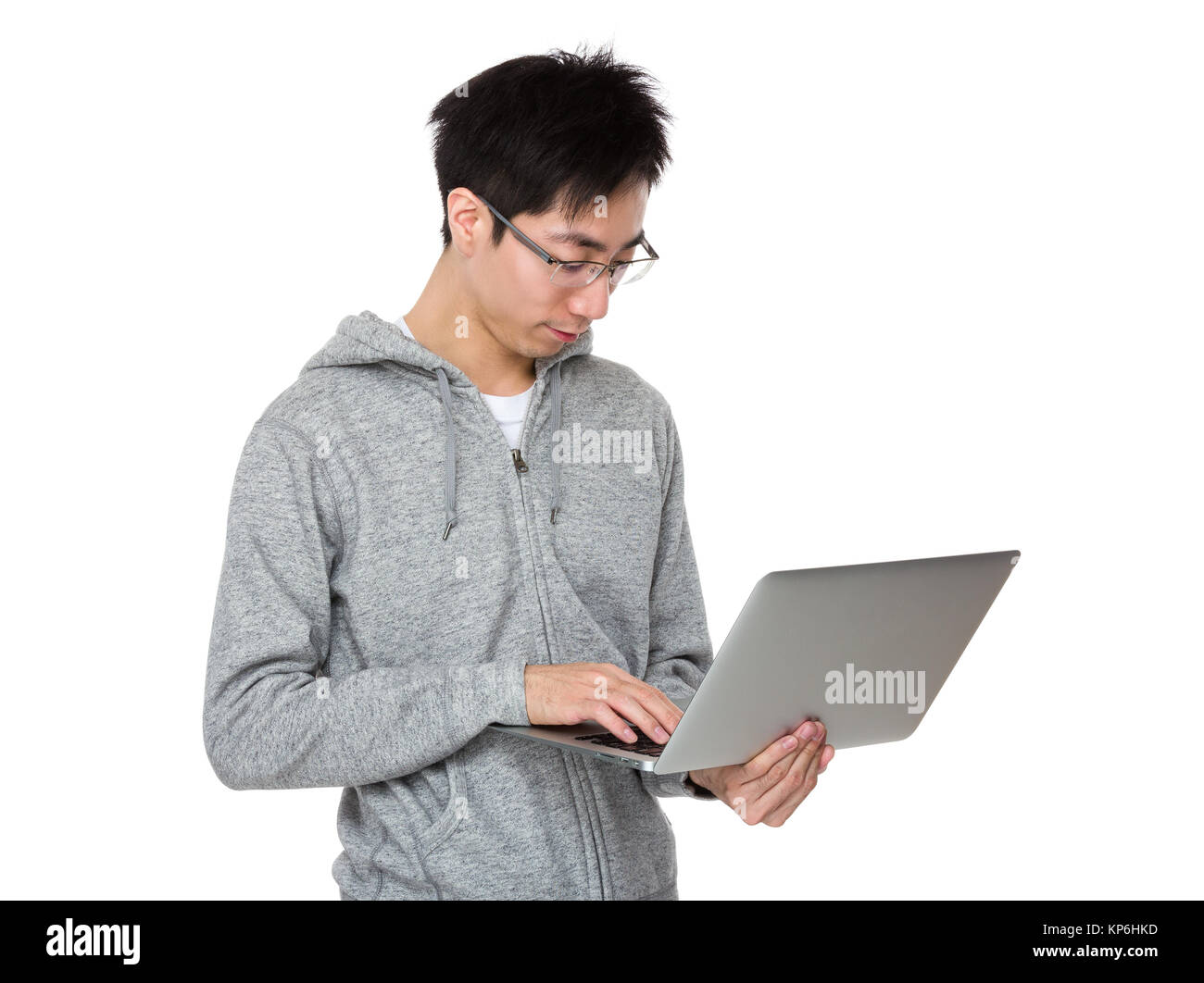 Young man use of laptop computer Stock Photo - Alamy