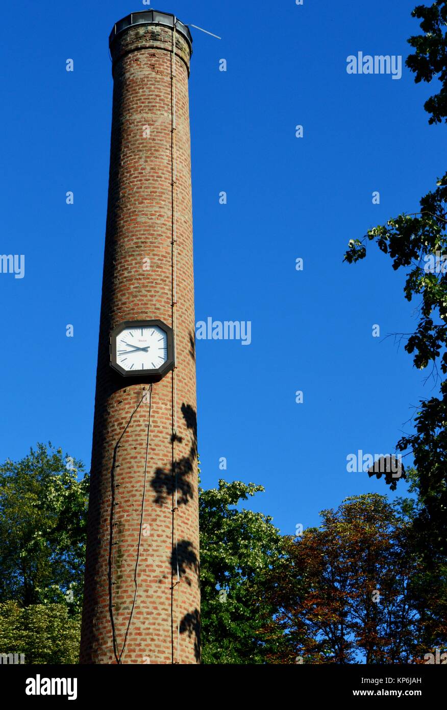 clock on the chimney Stock Photo - Alamy