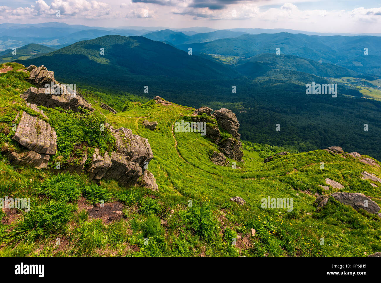 footpath among huge rocks on the edge of a hill. beautiful valley view ...