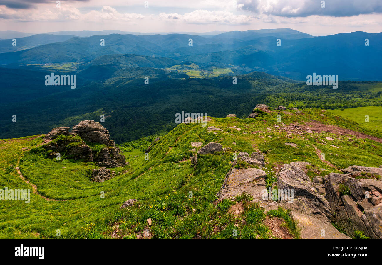 footpath among huge rocks on the edge of a hill. beautiful valley view ...