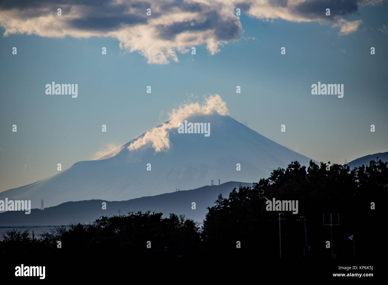 Mt Fuji silhouette in the setting sun in a park in central Kanagawa ...