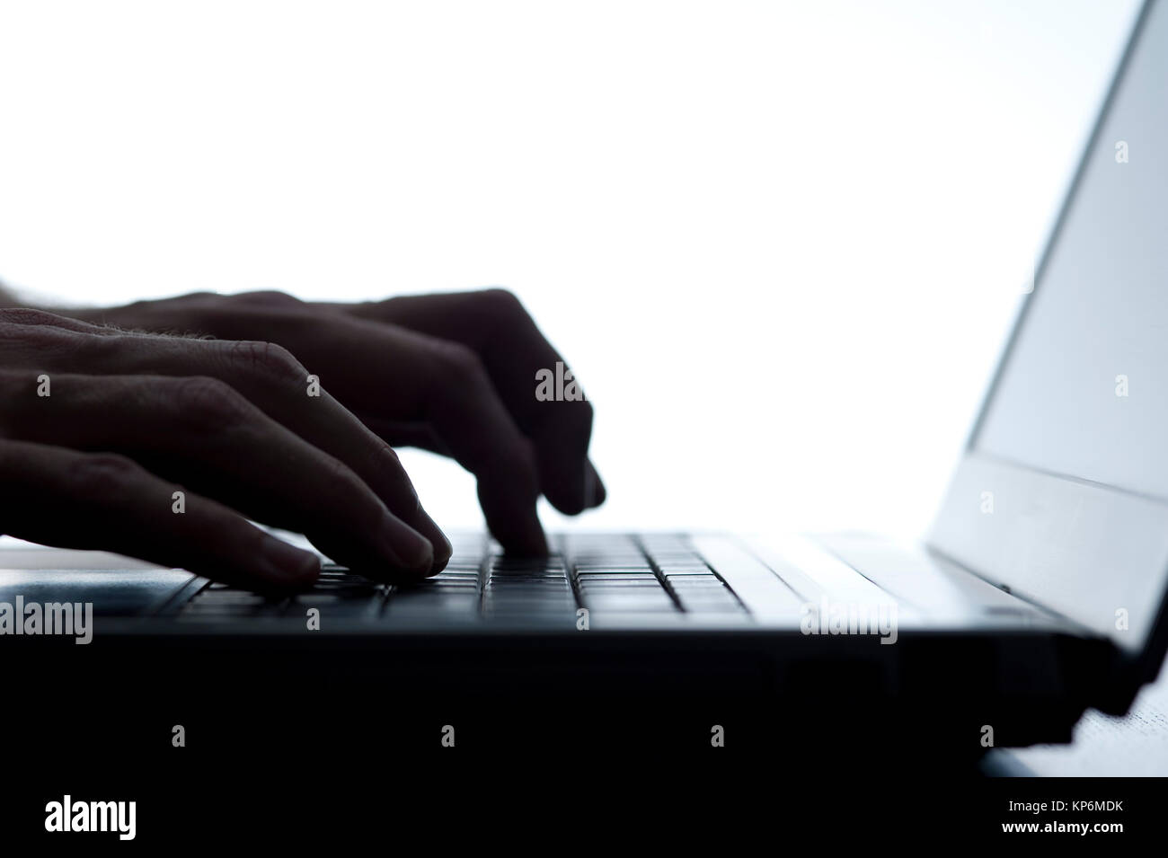 Person typing on a laptop keyboard Stock Photo - Alamy