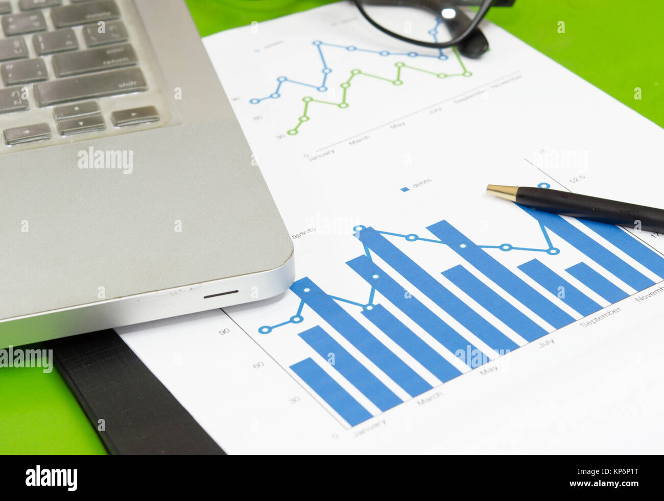 laptop and graphs Stock Photo - Alamy