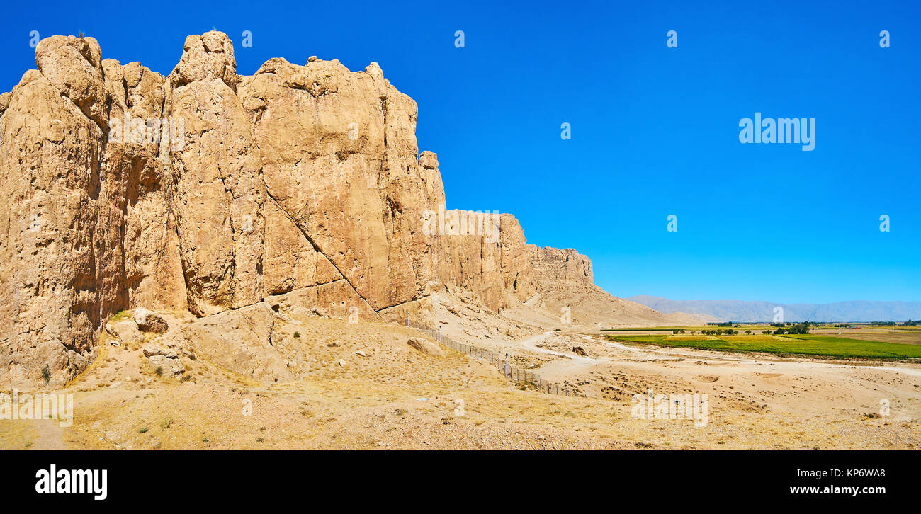 Panorama of yellow rocky cliffs and the agricultural lands, stretching ...