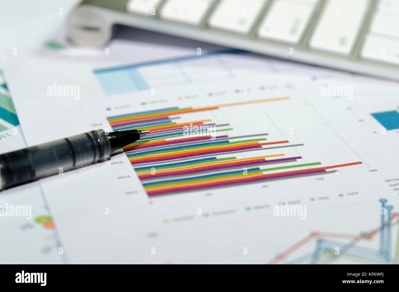 Graphs and pen Stock Photo - Alamy